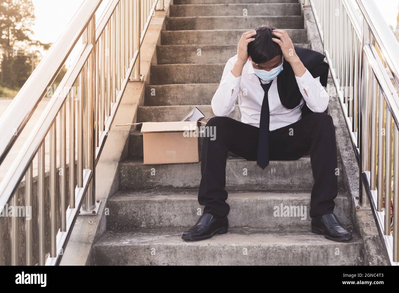 Asian Failure unemployed businessman stress sitting on stair Stock ...