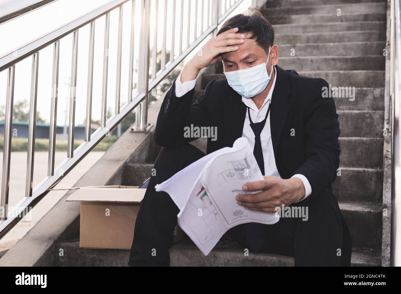 Asian Failure unemployed businessman stress sitting on stair Stock ...