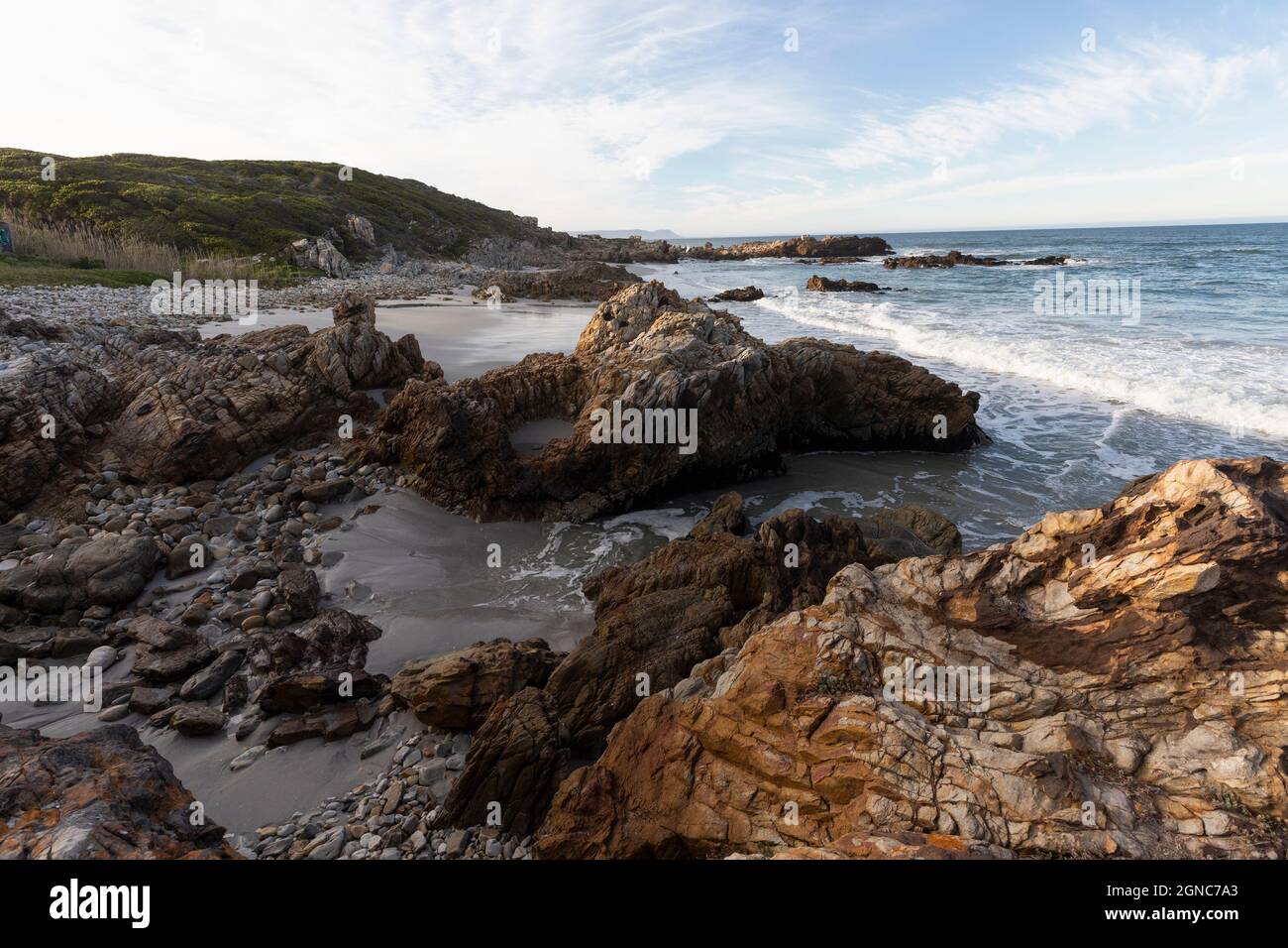 A deserted beach, jagged rocks and rockpools on the Atlantic coast ...