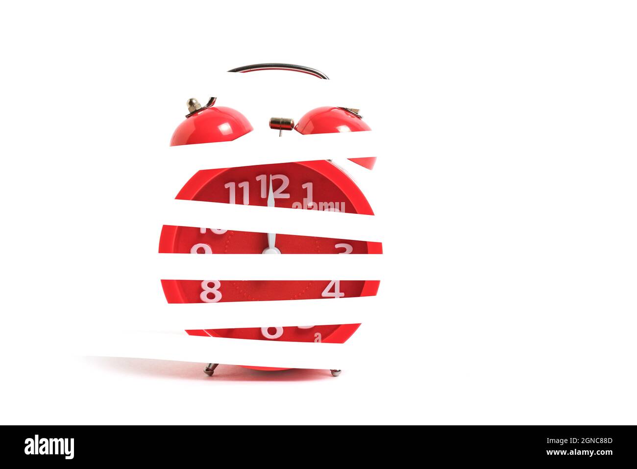 Red alarm clock is isolated on a white background, shows twelve clock ...