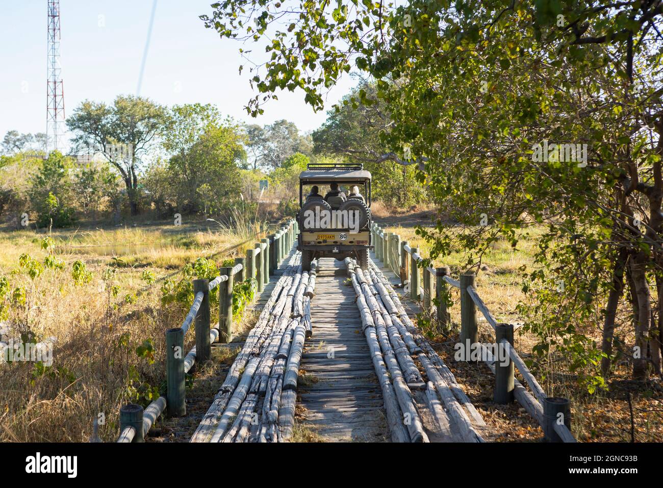 Safari vehicle crossing Fourth Bridge, Okavango Delta, Botswana Stock ...