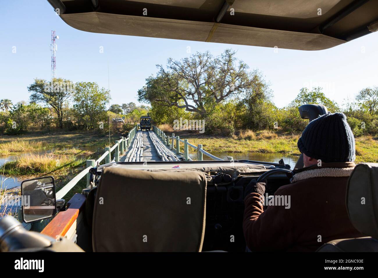 Safari vehicle crossing Fourth Bridge, Okavango Delta, Botswana Stock ...