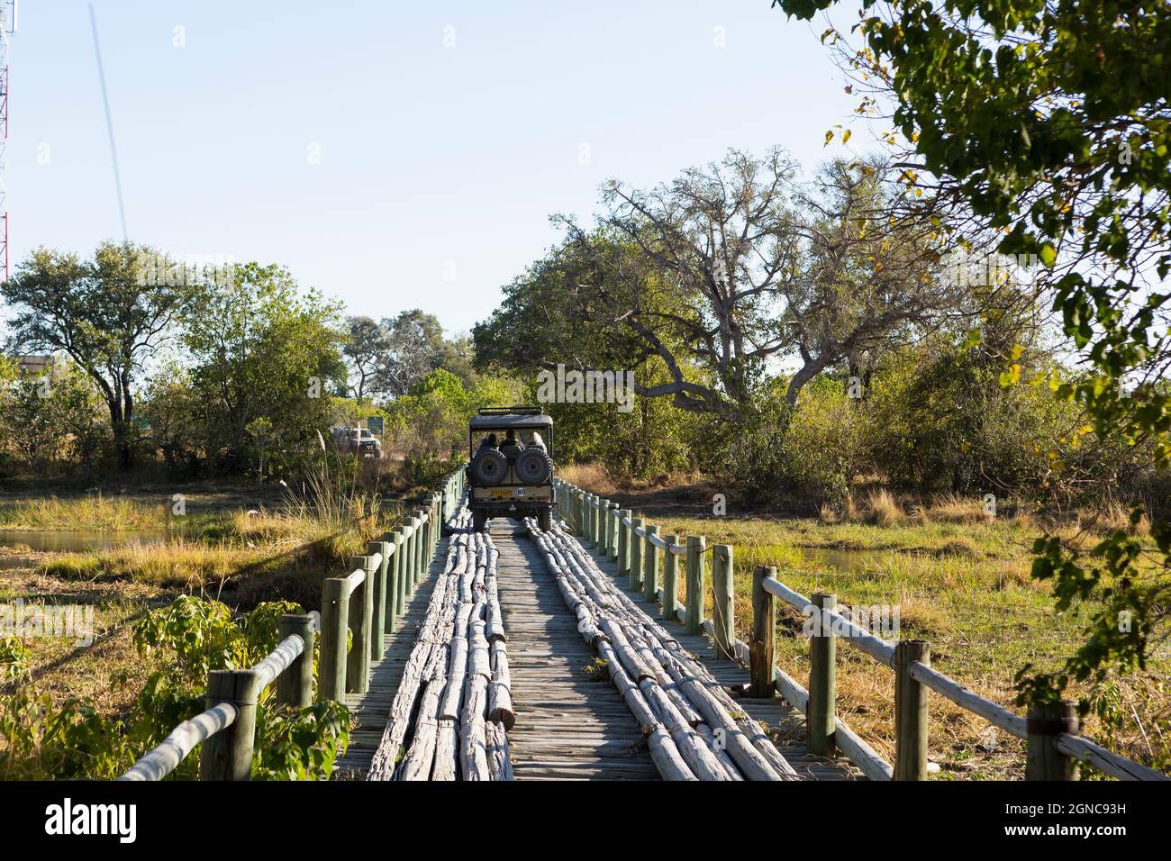 Safari vehicle crossing Fourth Bridge, Okavango Delta, Botswana Stock ...