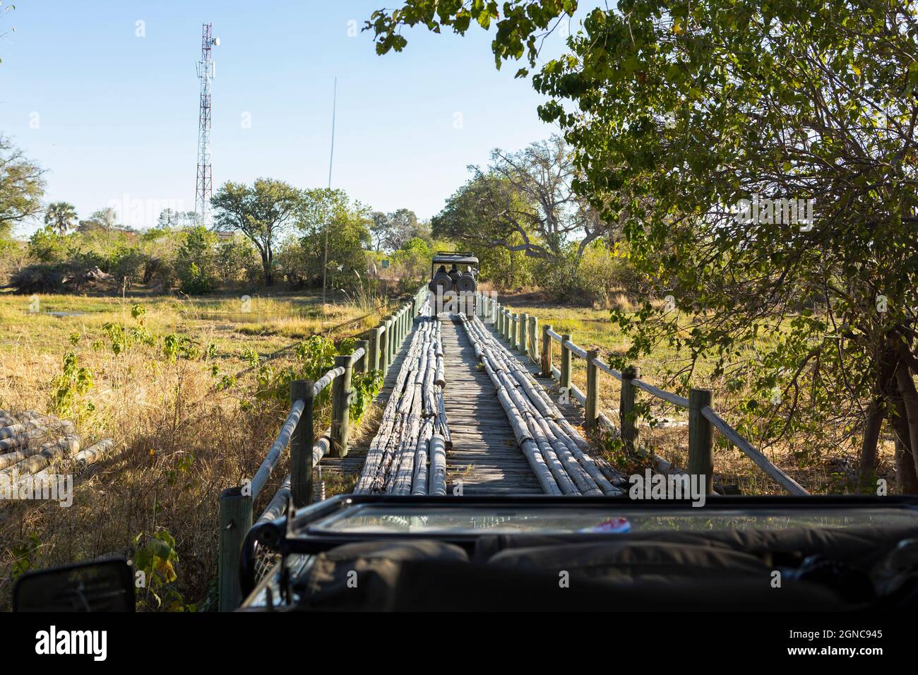 Safari vehicle crossing Fourth Bridge, Okavango Delta, Botswana Stock ...