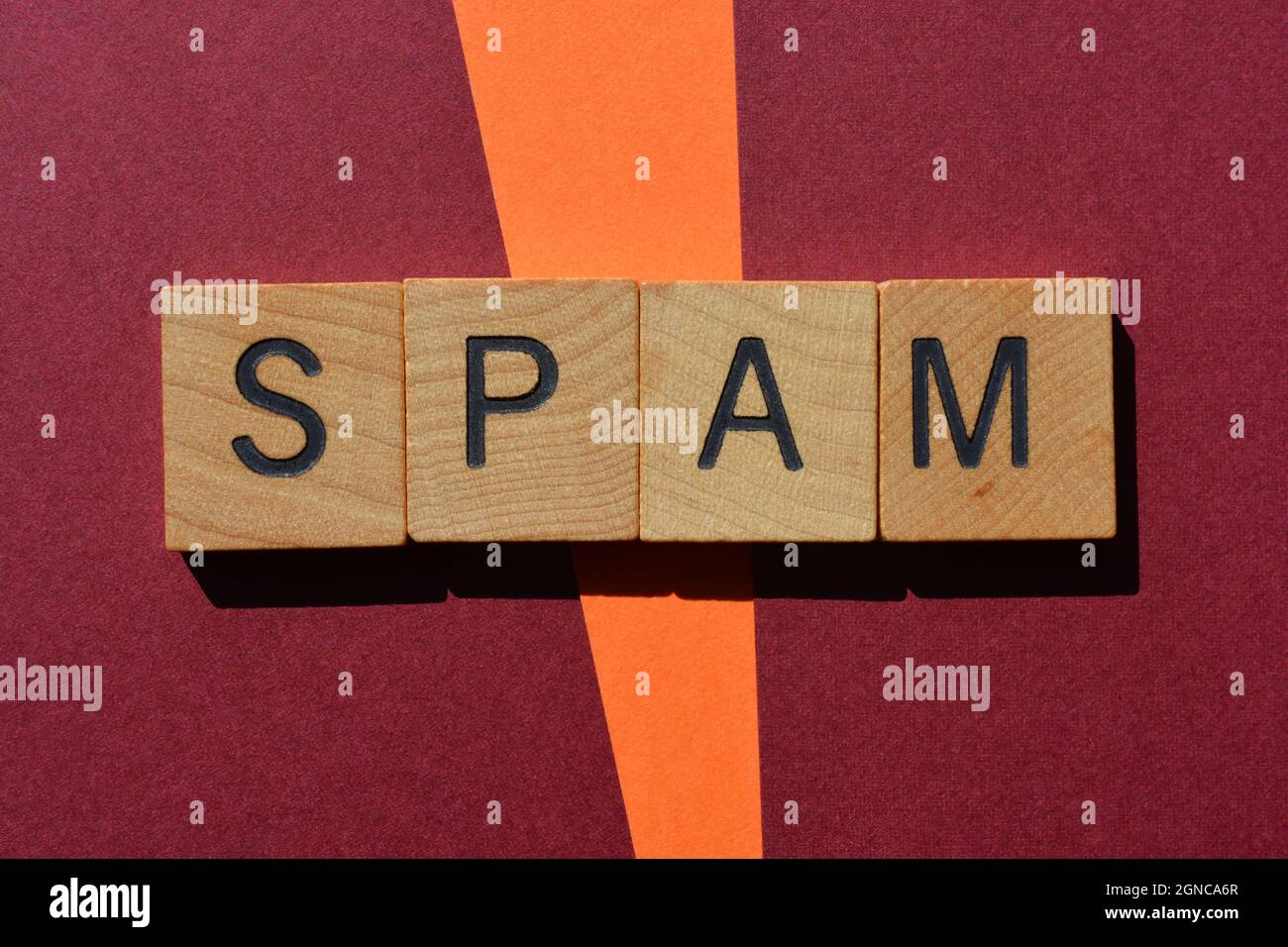 Spam, word in wooden alphabet letters isolated on background as banner ...