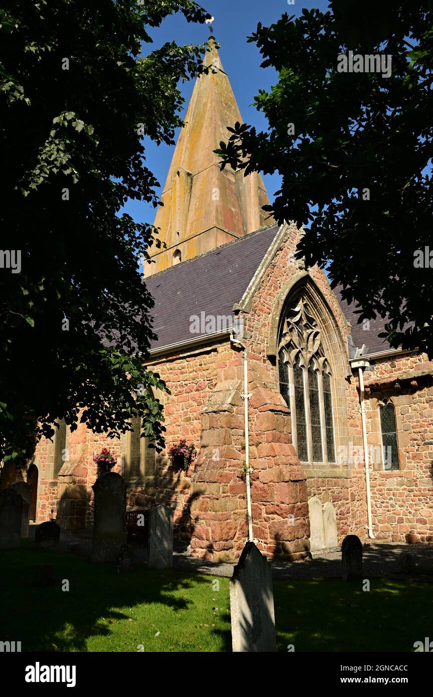An exterior view of the stone church building in the town of Grouville ...