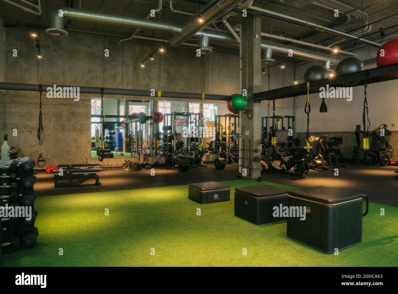 Weights room and exercise equipment in an empty gym Stock Photo - Alamy