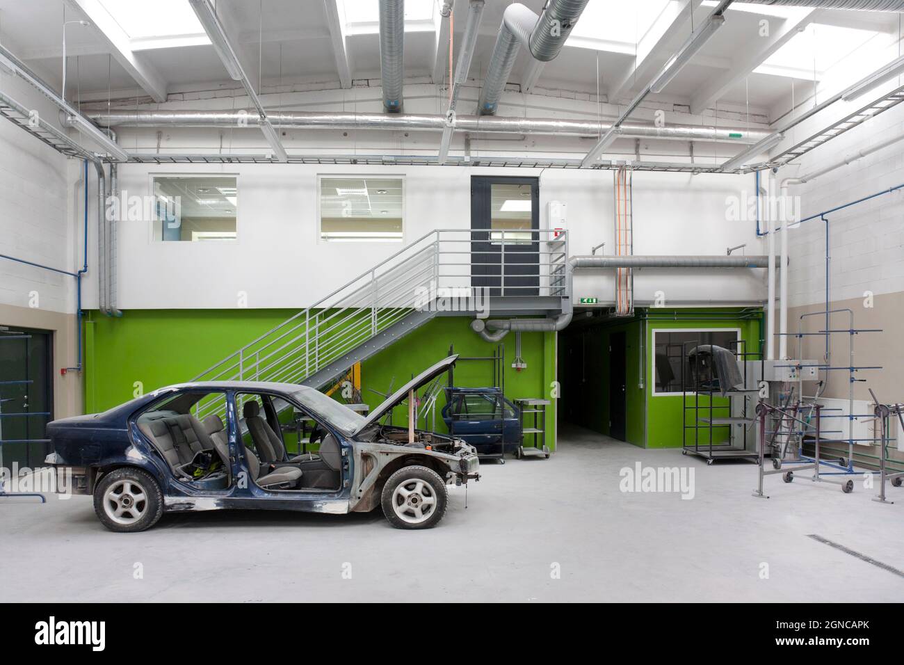 An old car with the bonnet up in a garage for repair Stock Photo - Alamy