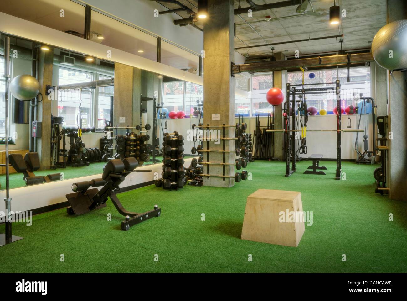 Weights room in an empty gym Stock Photo - Alamy