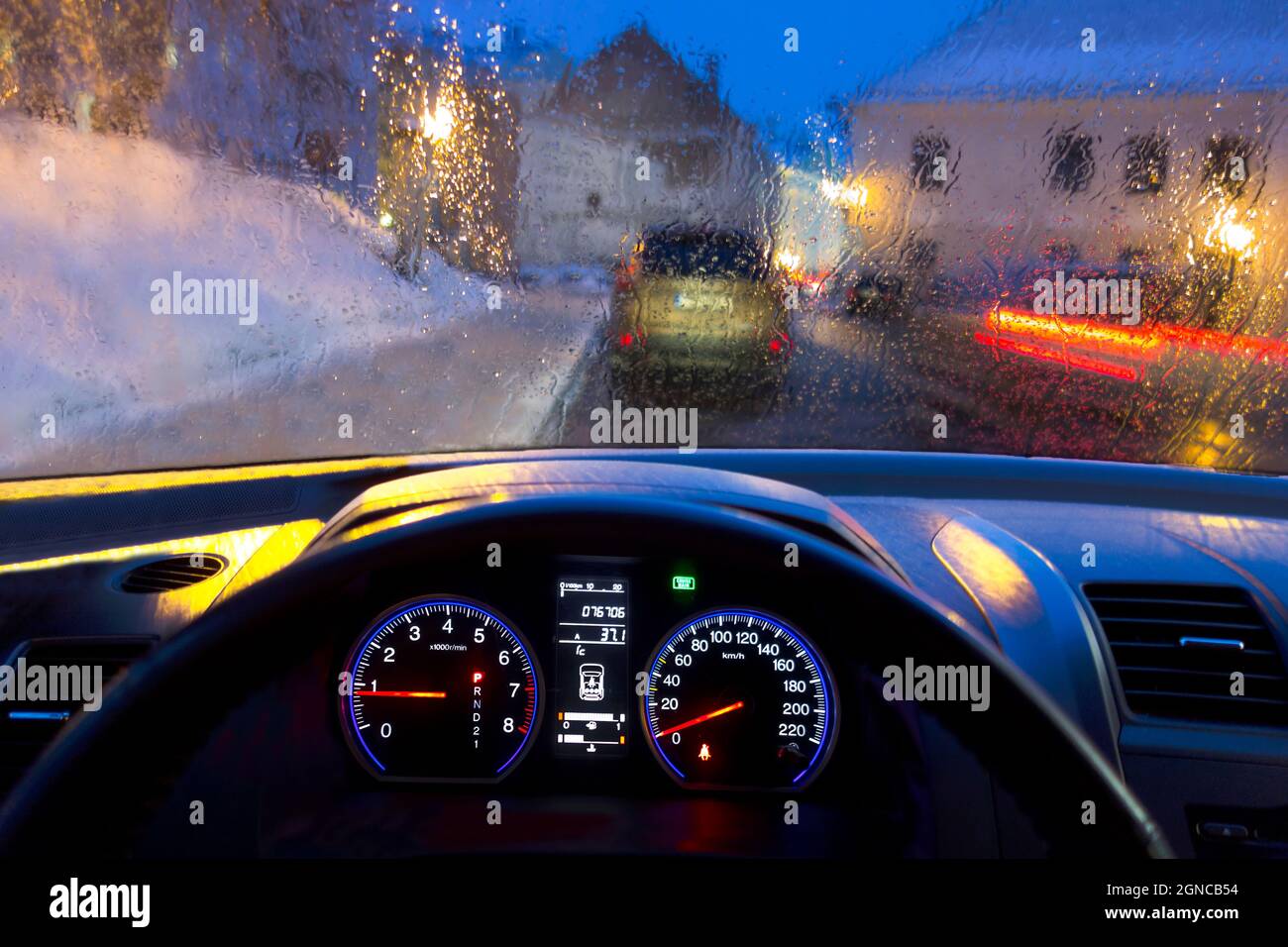 Car interior and illuminated street view. Dashboard, speedometer Stock ...
