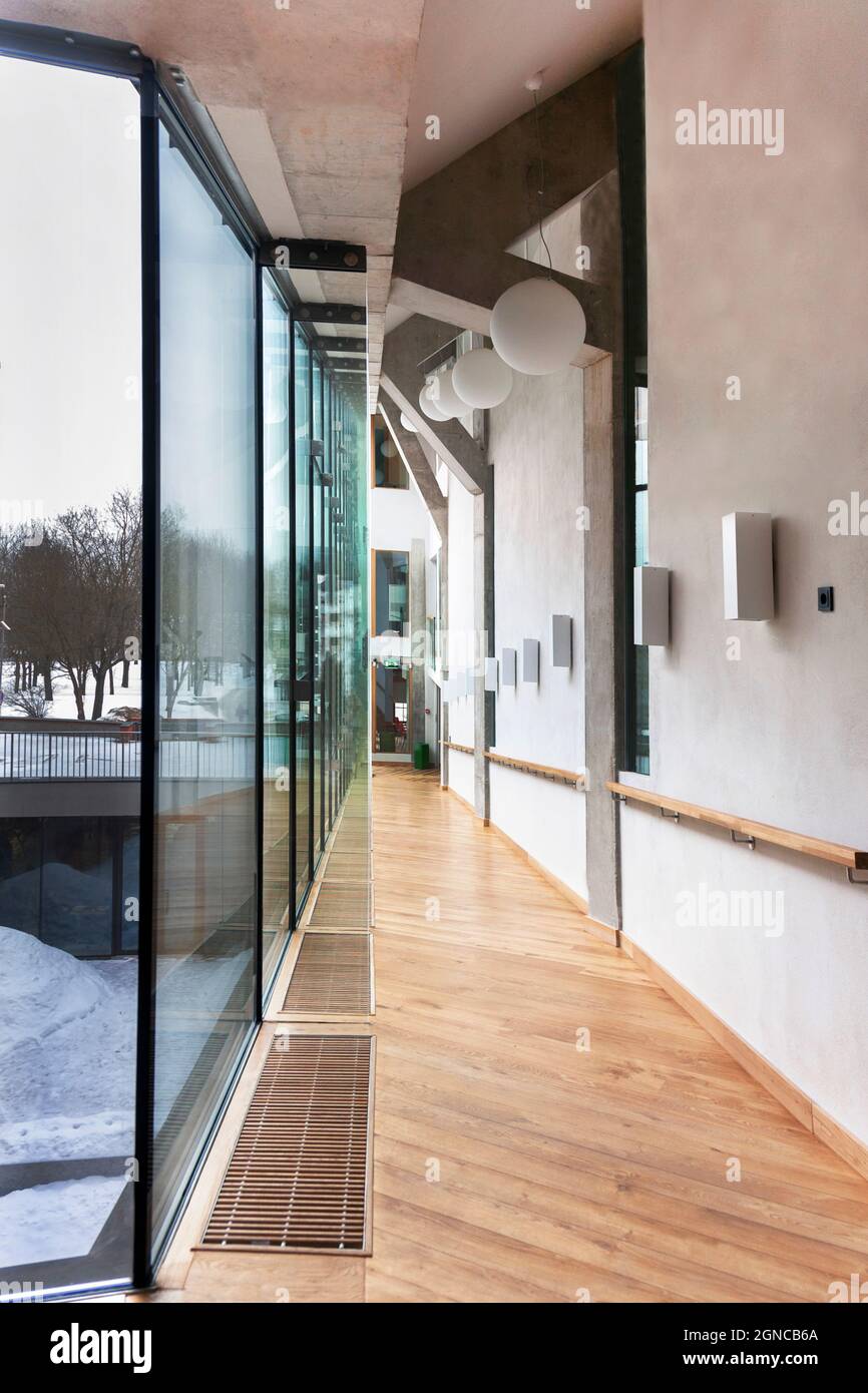 Modern building in a university, glass walls and an indoor walkway ...