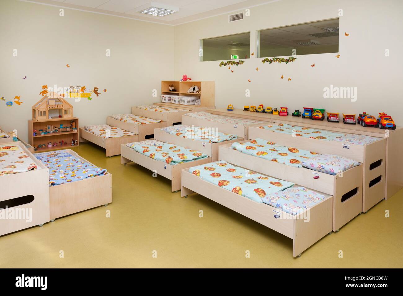Modern day care nursery or pre-school kindergarten school, bedrooms for ...