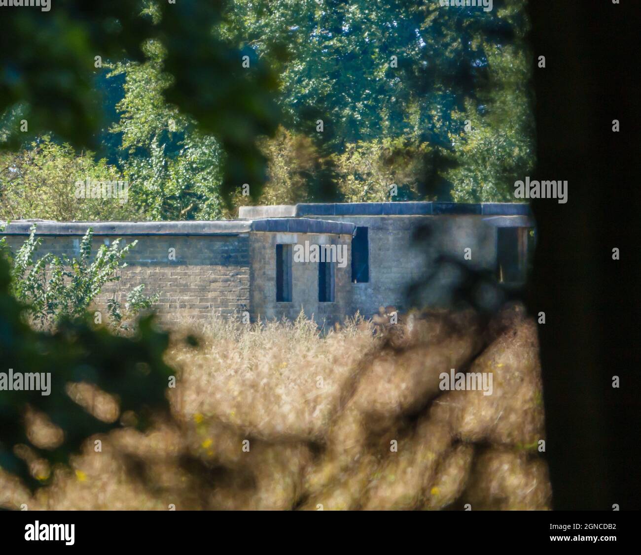 view through trees of British army fortified buildings and structures ...