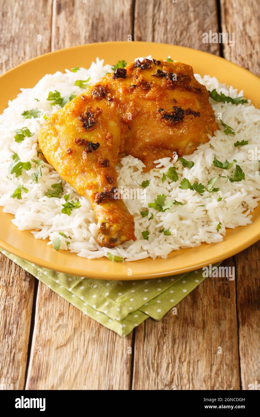 Ayam Percik Coconut Spiced Chicken with rice close up in the plate on ...