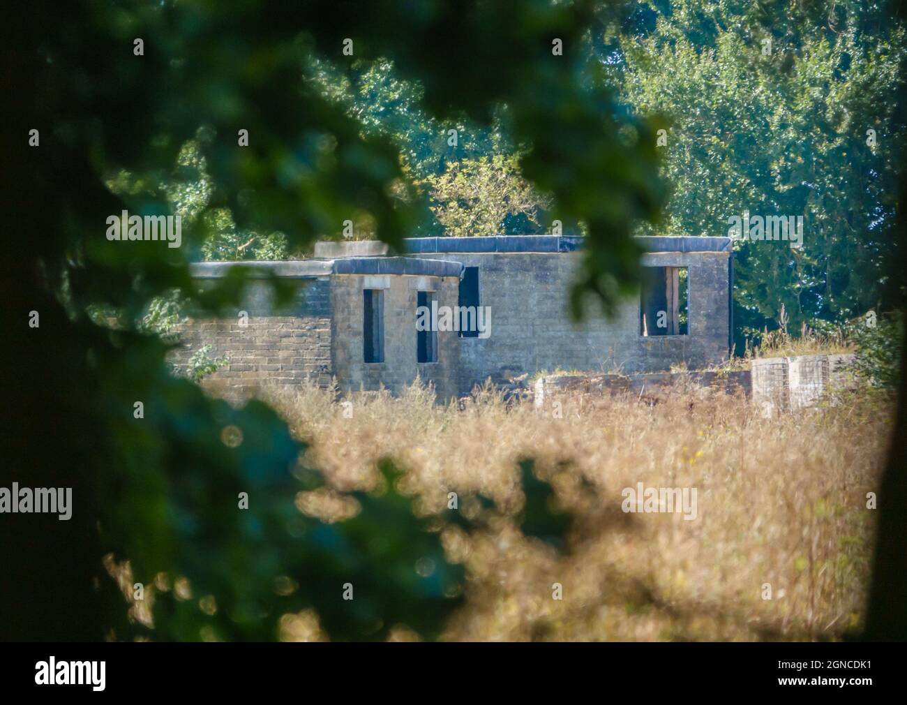 view through trees of British army fortified buildings and structures ...