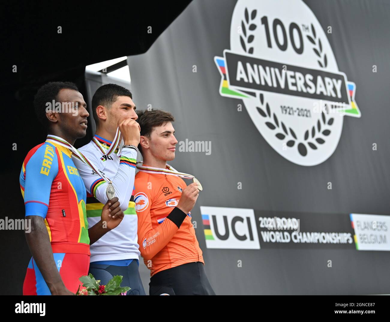 Eritrean Biniam Girmay, Italian Filippo Baroncini and Dutch Olav Kooij pictured on the podium ...