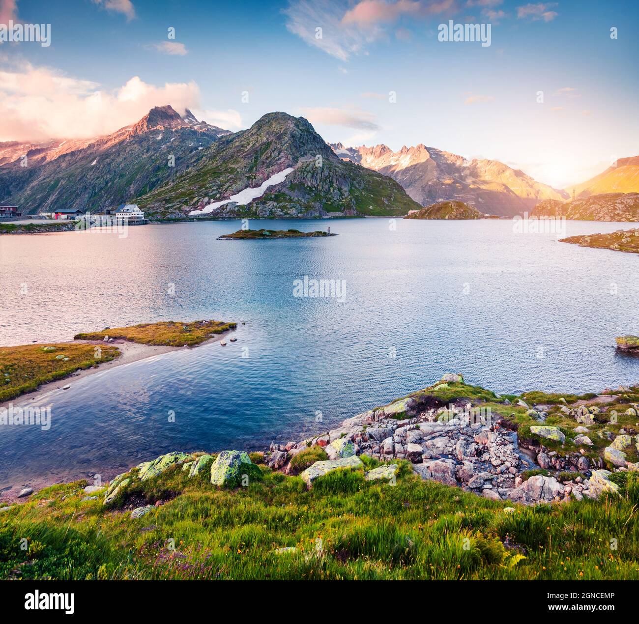 Colorful summer sunset on the Totensee lake on the top of Grimselpass ...