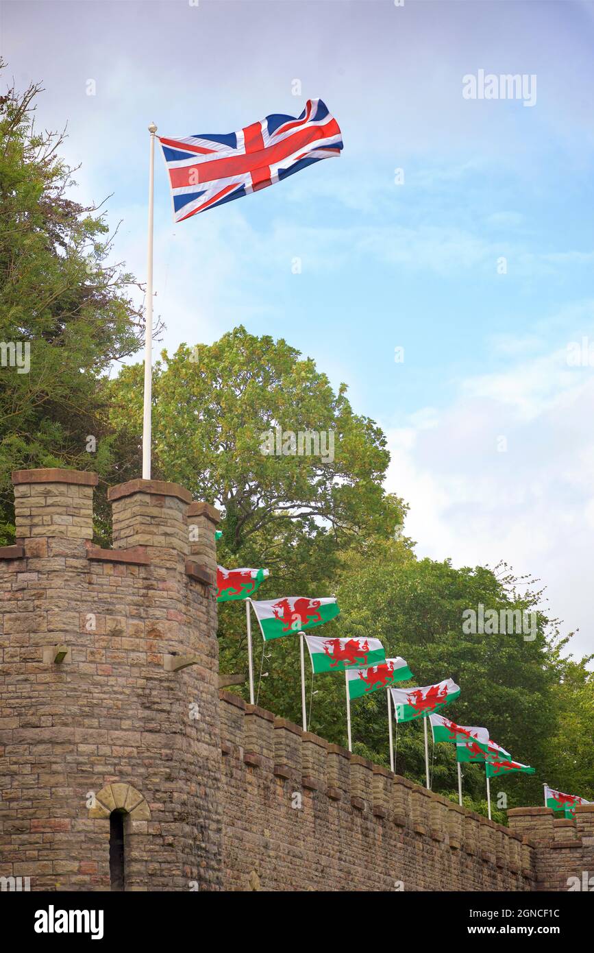 Welsh flags flying above the stone walls of Cardiff Castle, Wales ...