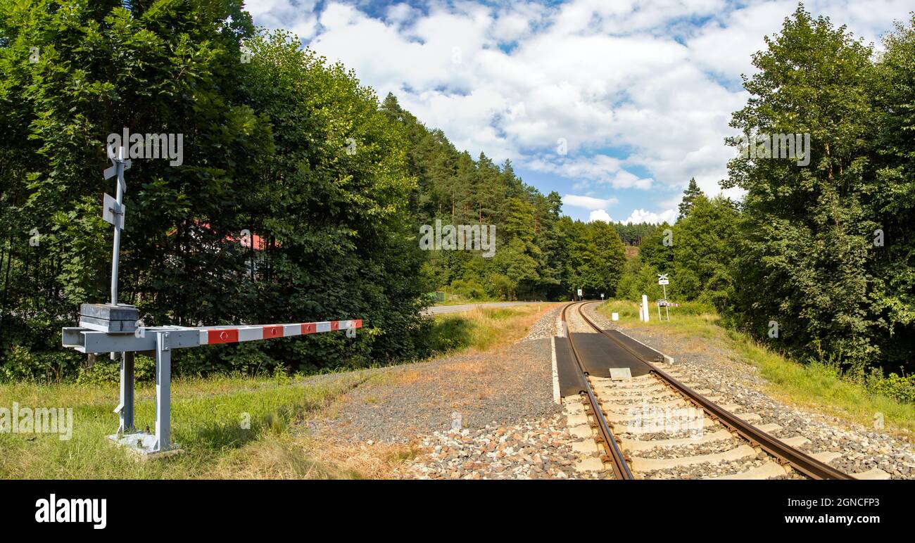 Barriers on a path that crosses the track Stock Photo - Alamy