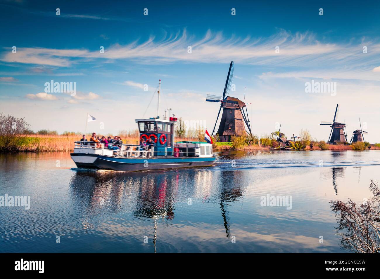 Famous windmills in Kinderdijk museum in Holland. Sunny spring morning ...