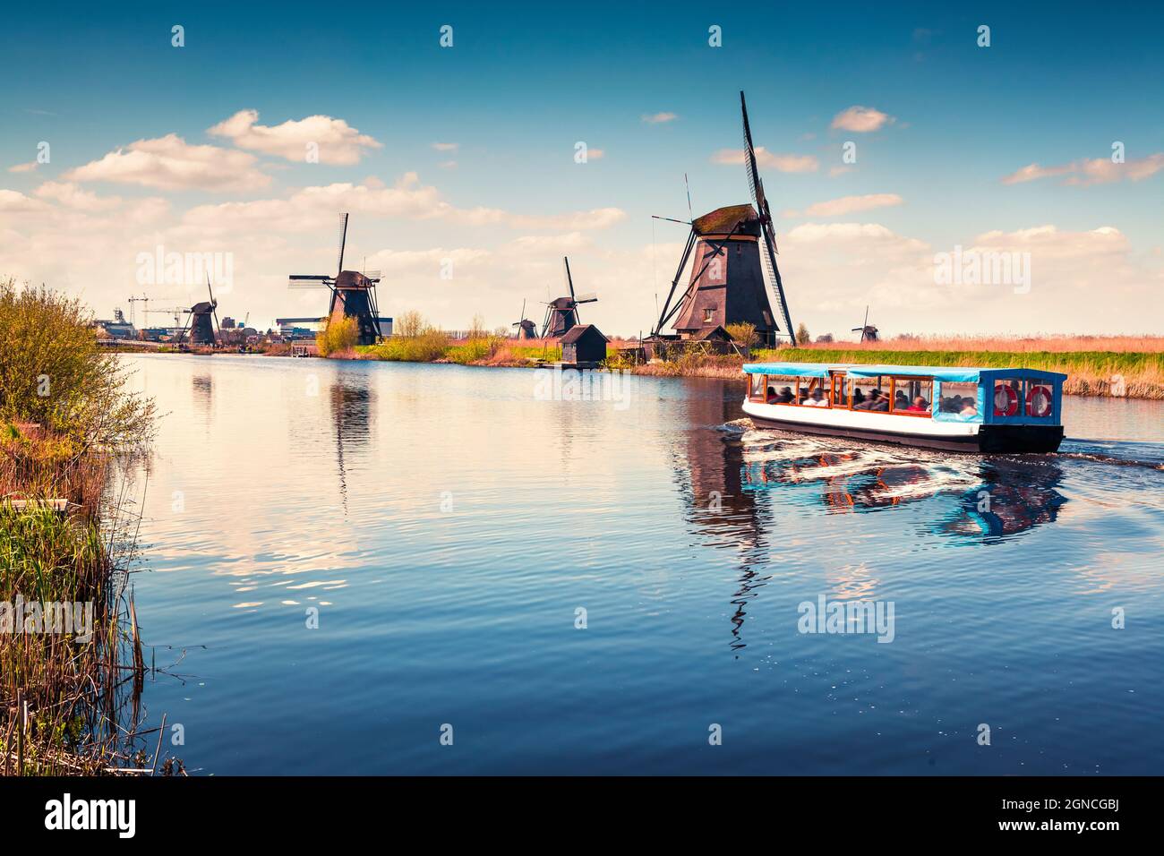 Famous mindmills in Kinderdijk museum in Holland. Sunny spring morning ...