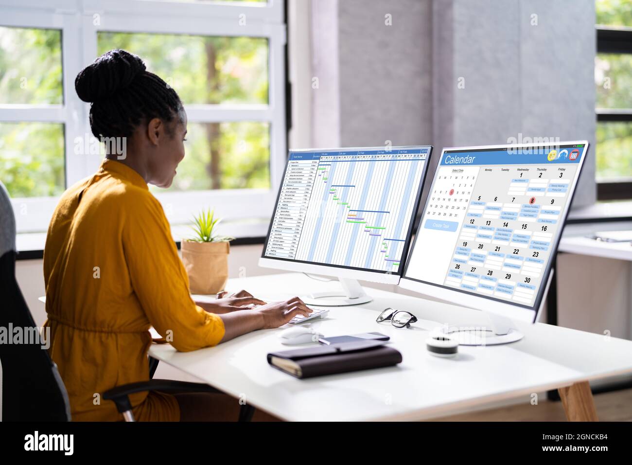 Woman Working On Calendar Agenda Schedule On Computer Stock Photo - Alamy