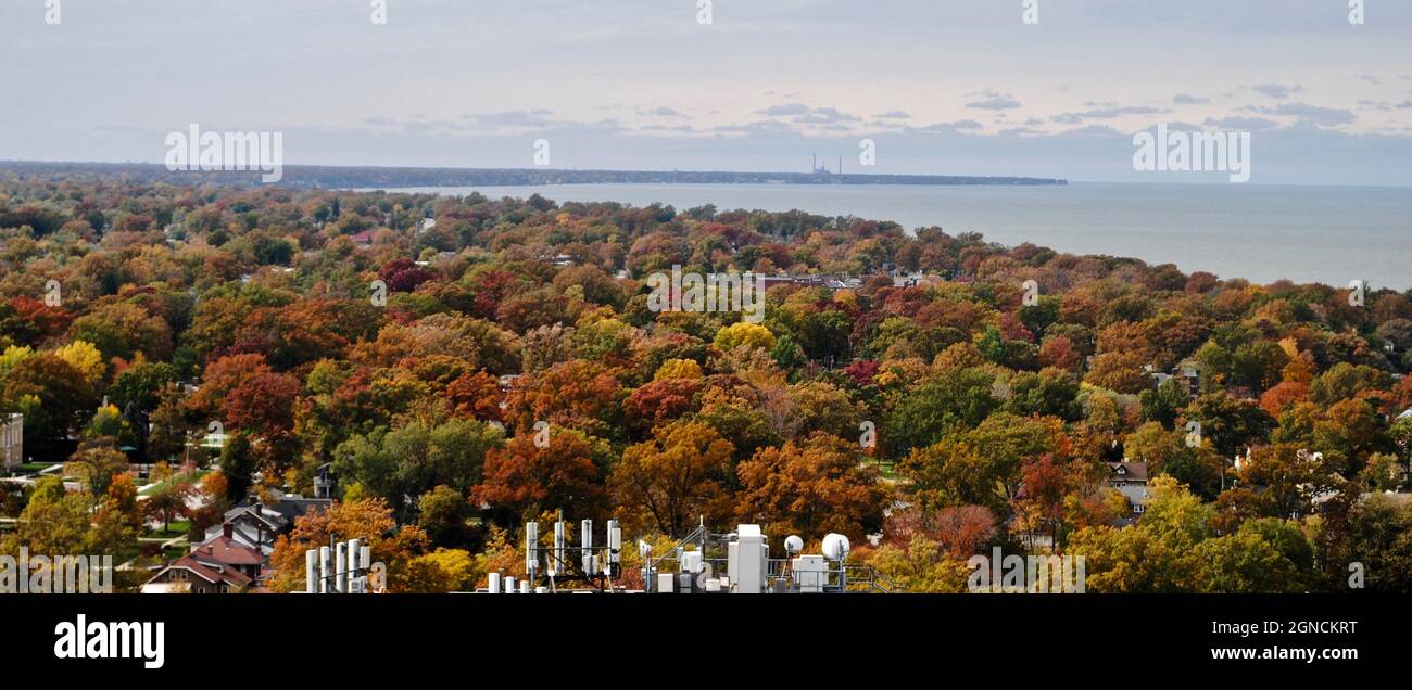 colorful fall foliage over Lakewood along Lake Erie in Northeastern ...