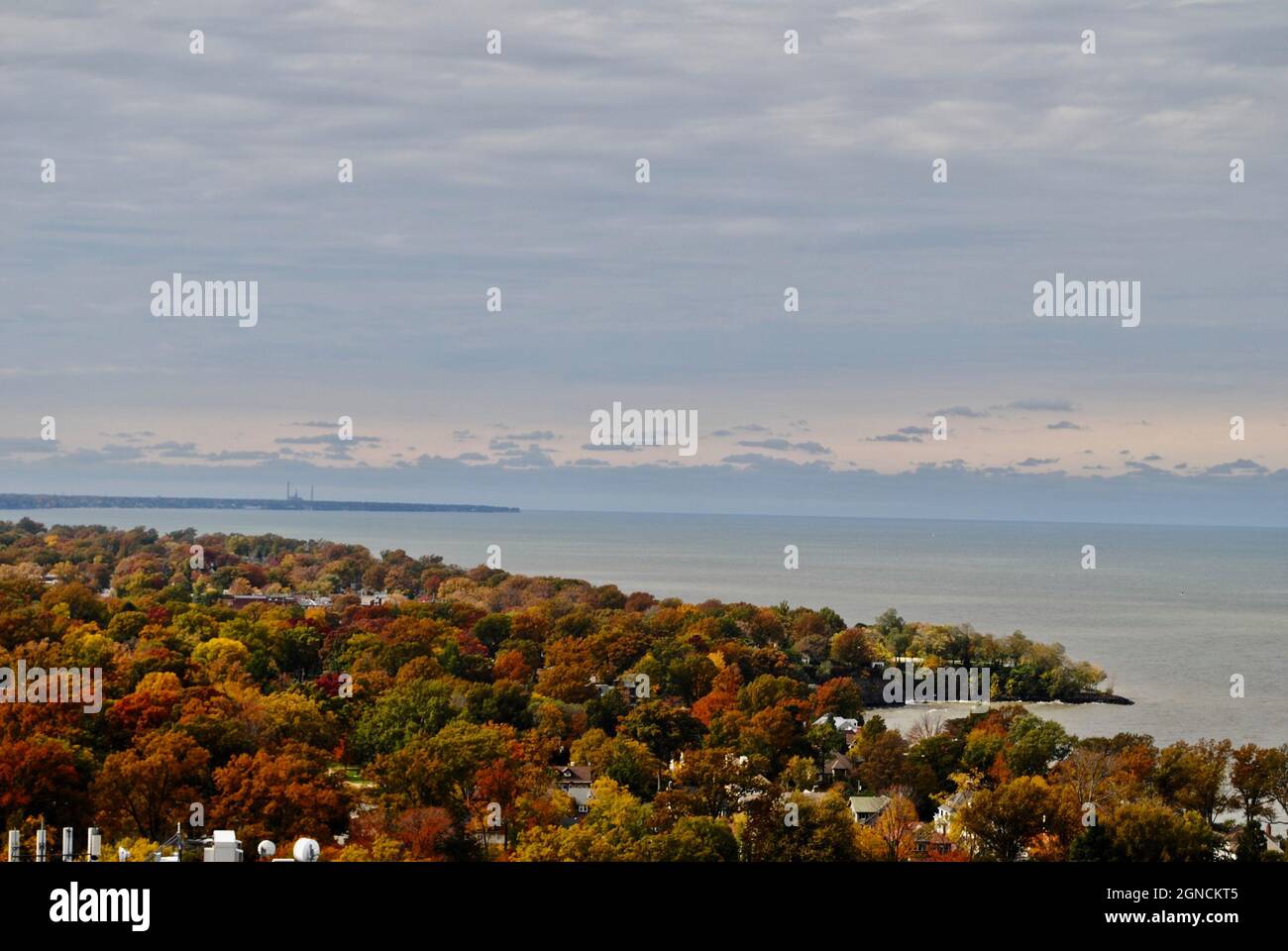colorful fall foliage over Lakewood along Lake Erie in Northeastern ...