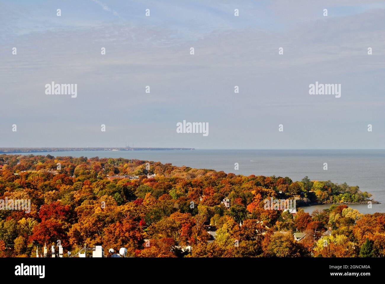 colorful fall foliage over Lakewood along Lake Erie in Northeastern ...