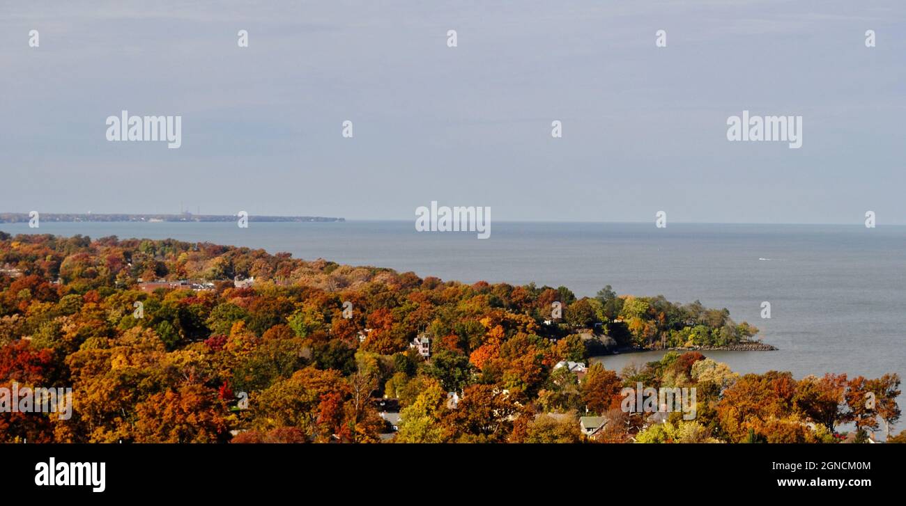 colorful fall foliage over Lakewood along Lake Erie in Northeastern ...