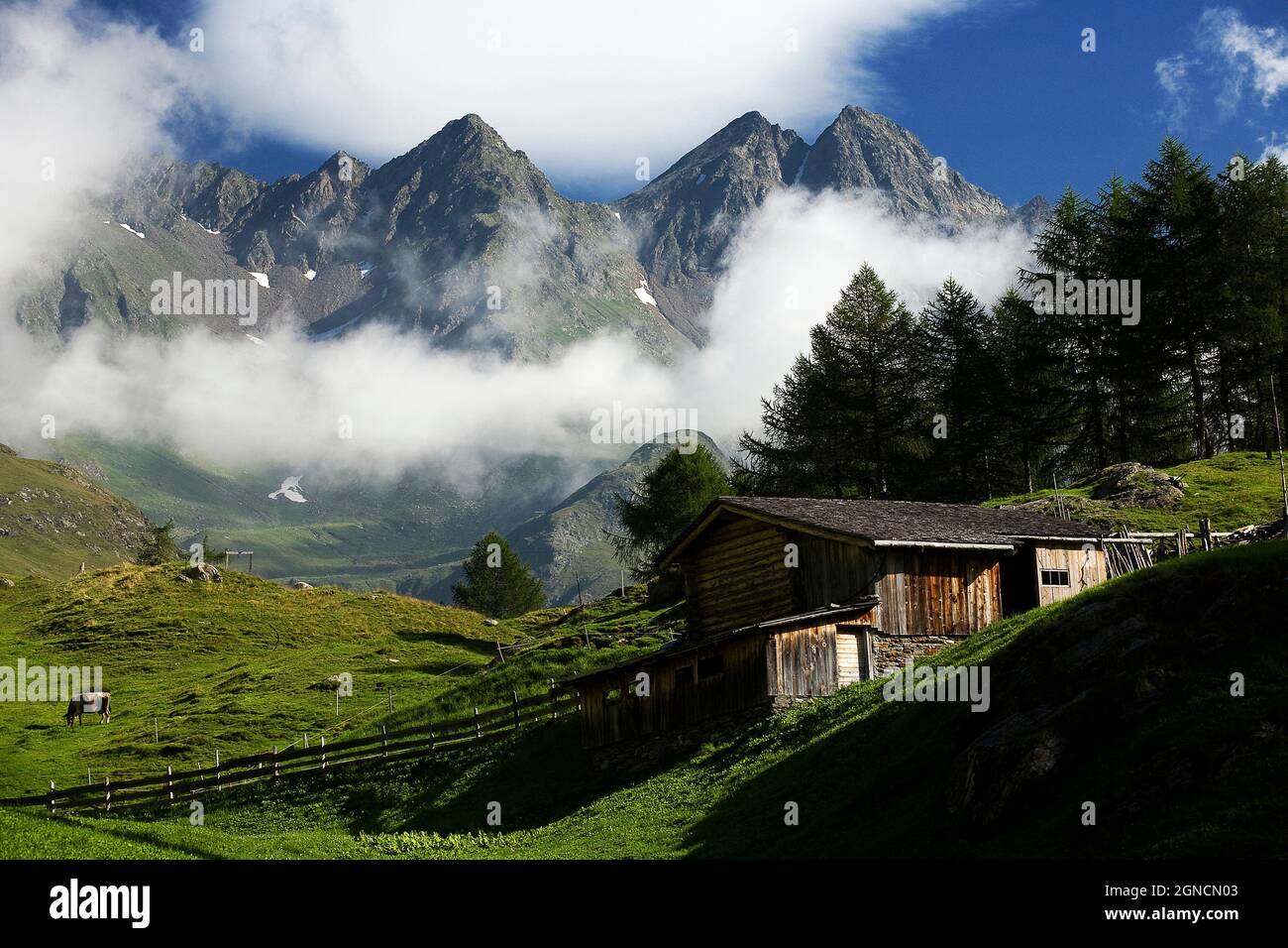Mountain landscape with hut Stock Photo - Alamy