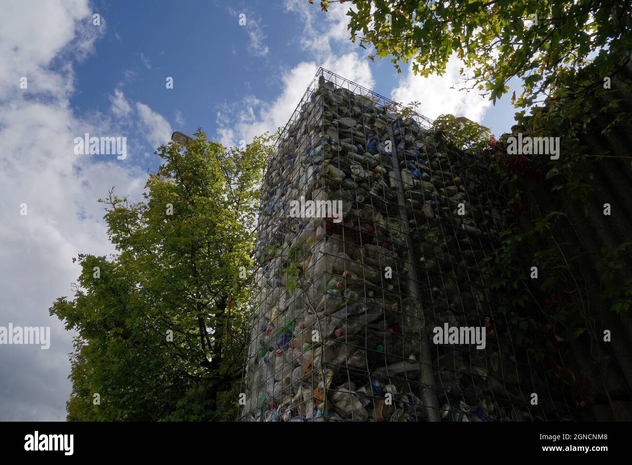 Old plastic bottles and aluminium cans squashed and compressed. They ...