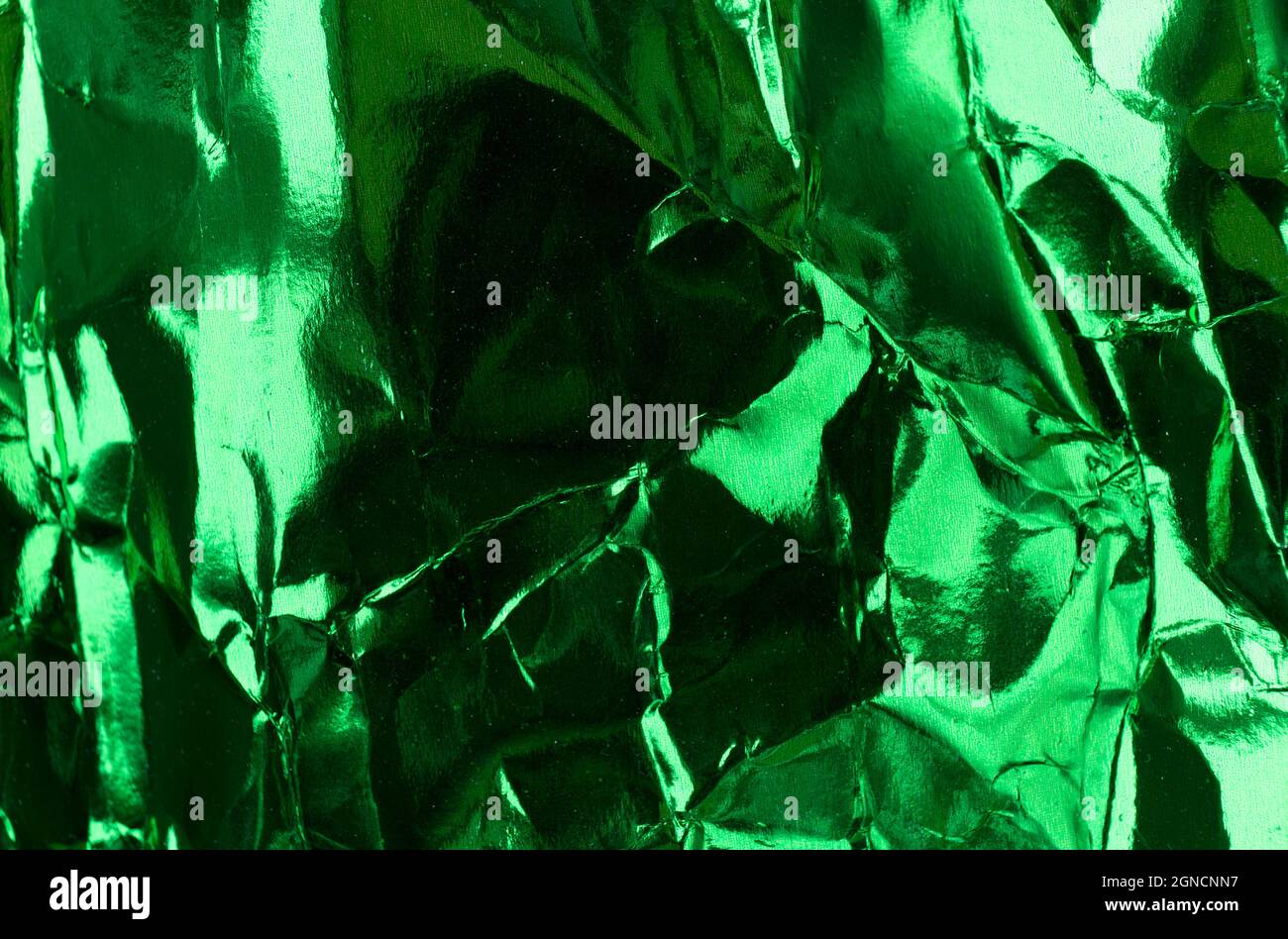 Crumpled green foil paper texture Stock Photo - Alamy
