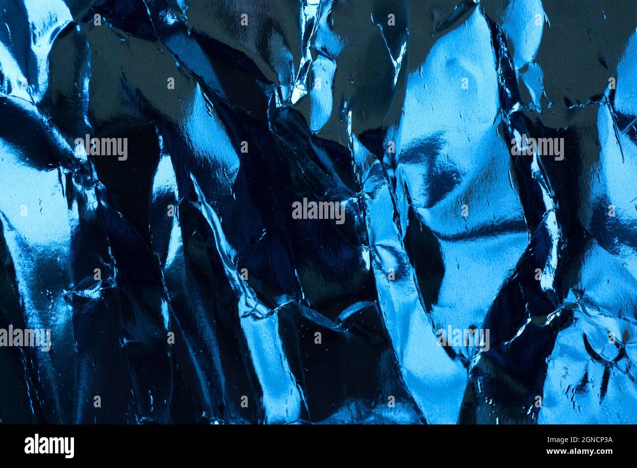 Crumpled blue foil paper texture Stock Photo - Alamy