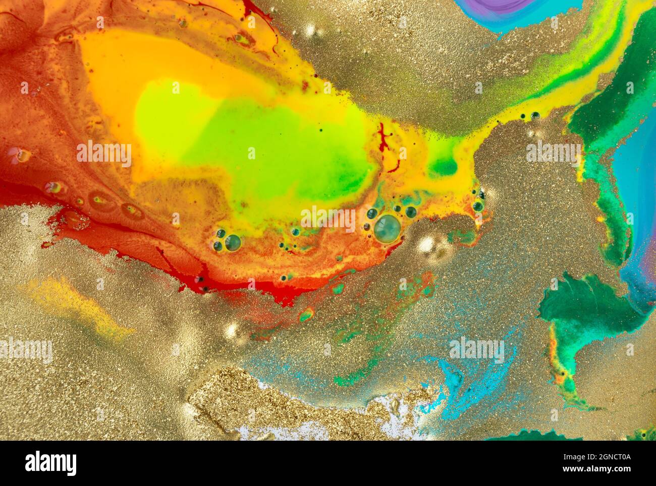 Gold spots on rainbow smudges of paint. Abstract pattern Stock Photo ...