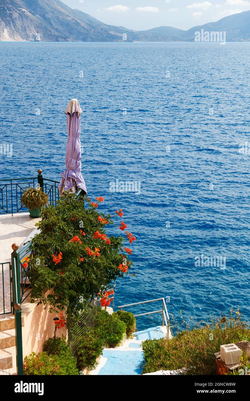 Small terrace and traditional greek blue stairs with sea view in Asos ...