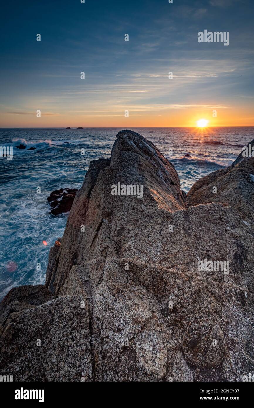 The sun sets over the California coast Stock Photo - Alamy