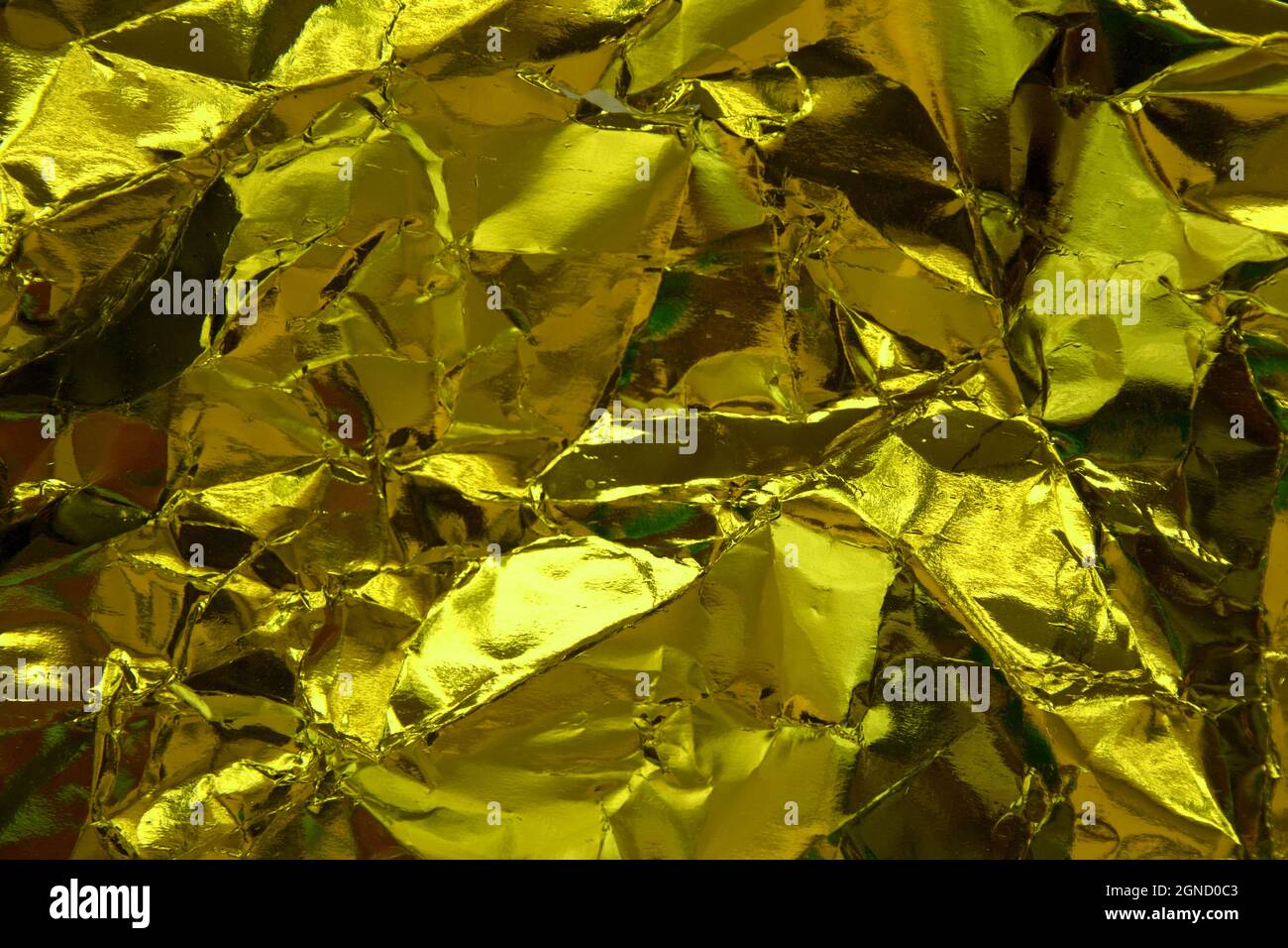 Crumpled yellow gold paper texture Stock Photo - Alamy