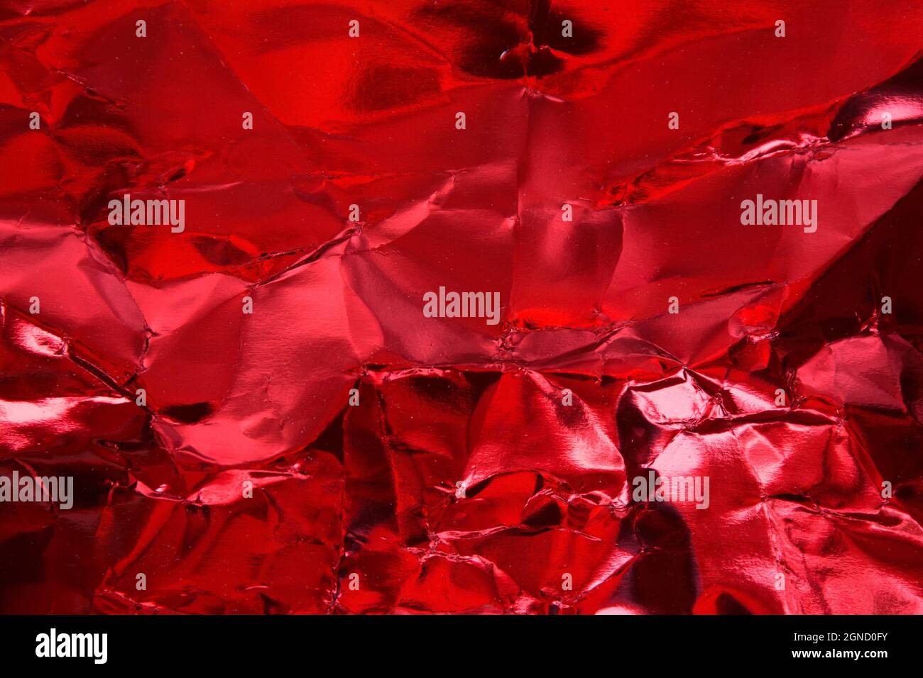 Crumpled red foil paper texture Stock Photo - Alamy