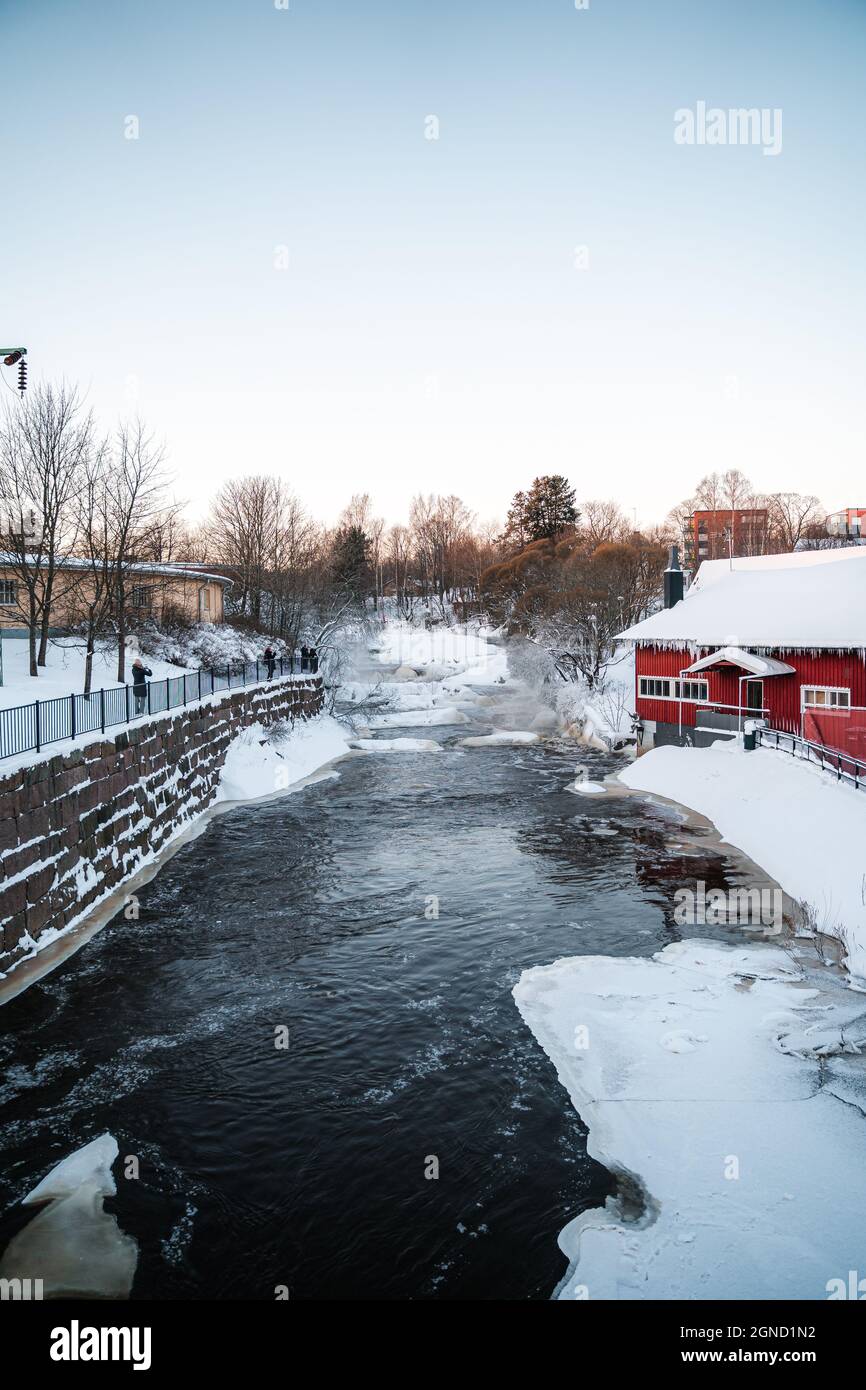 Red house by a snowy river during winter Stock Photo - Alamy