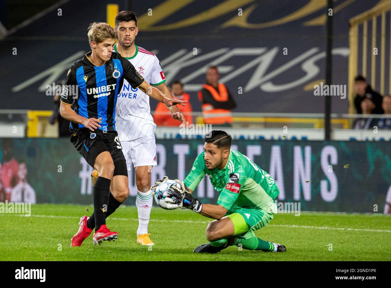 Club's Charles De Ketelaere and OHL's goalkeeper Rafael Romo fight for ...
