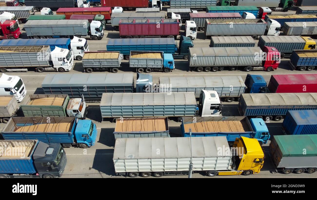 Trucks with containers and trailers in the port are waiting to be ...
