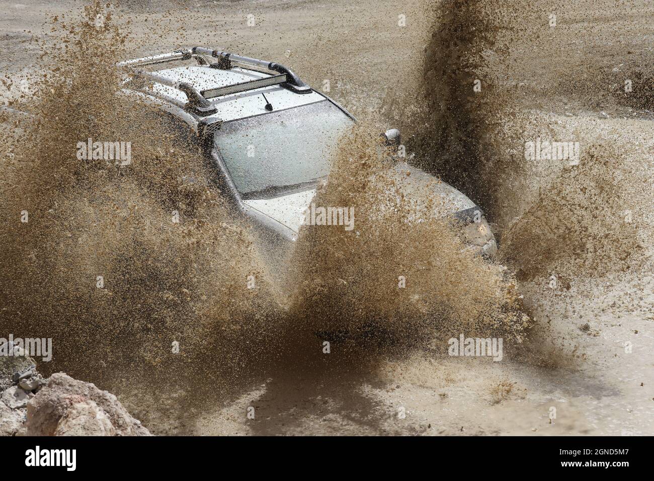Offroad racing. The Pickup is getting into the mud Stock Photo - Alamy