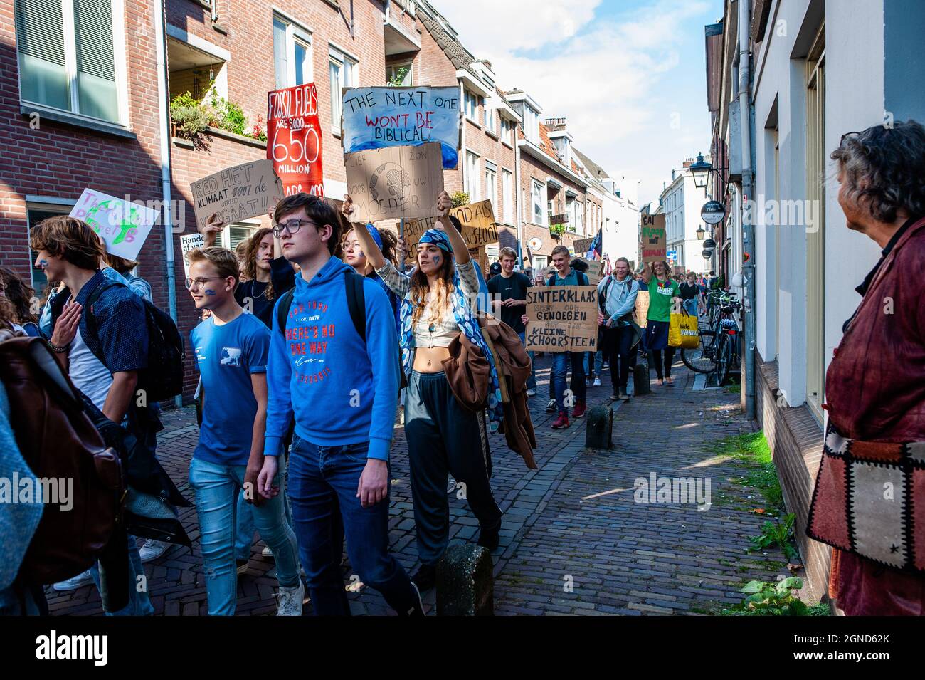 Utrecht, Netherlands. 24th Sep, 2021. Protesters hold placards while ...