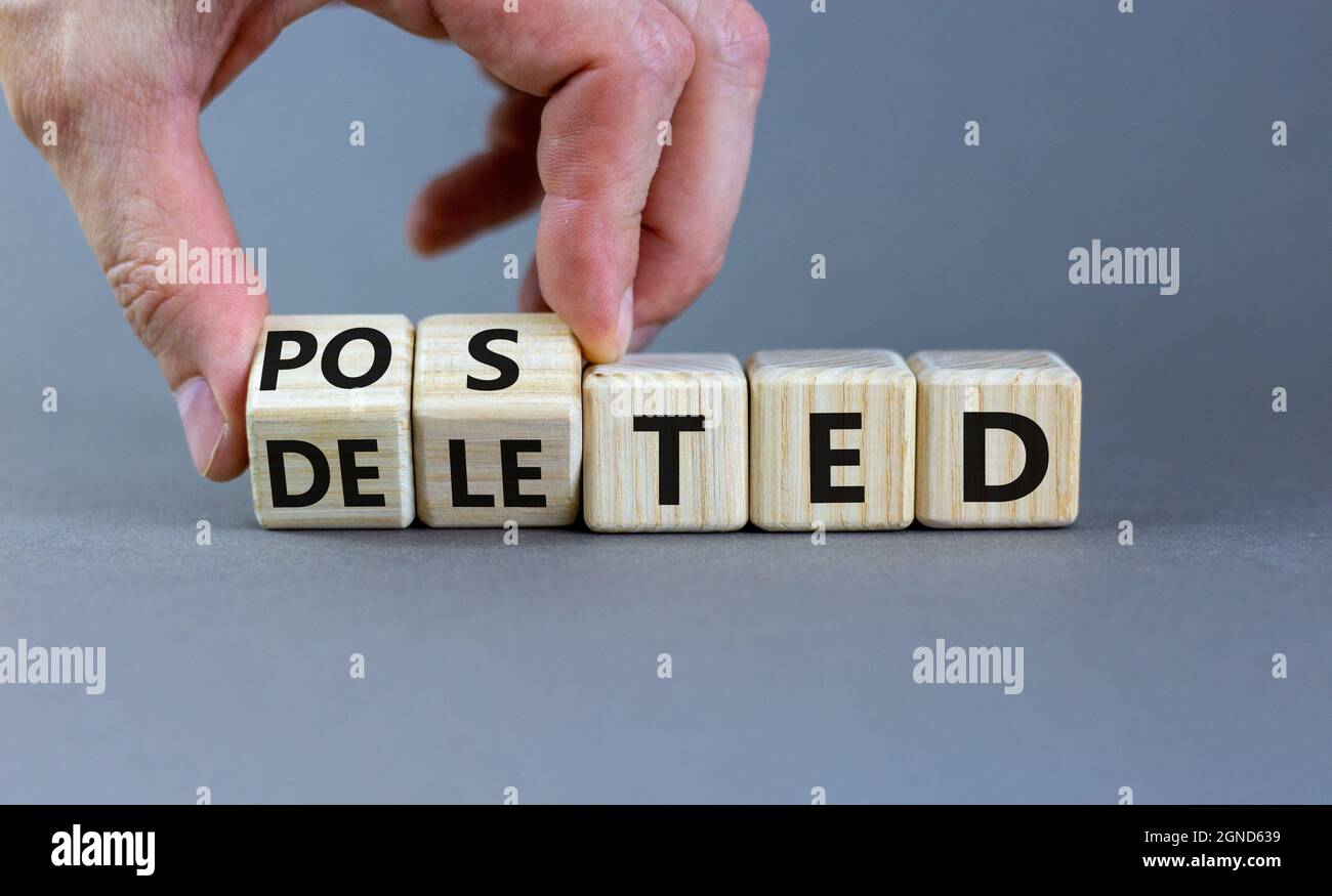 Posted or deleted symbol. Businessman turns wooden cubes and changes ...