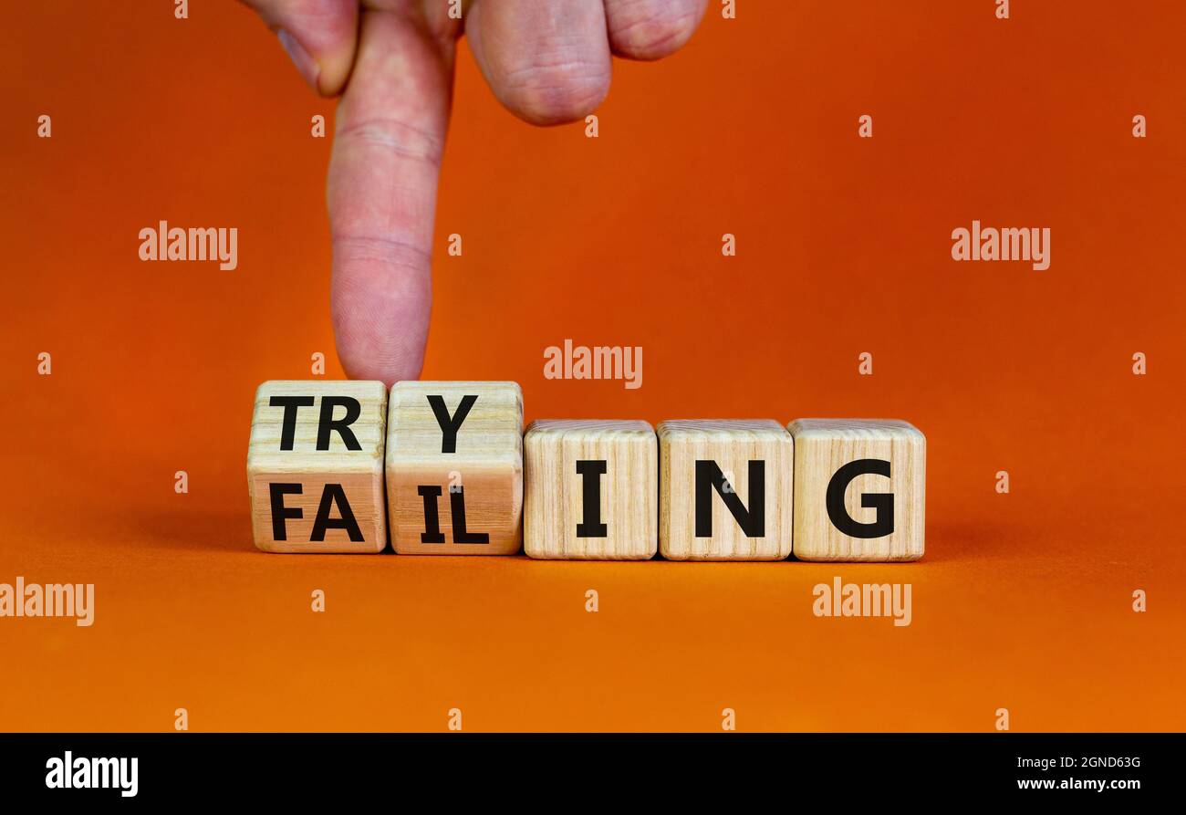 Failing or trying symbol. Businessman turns wooden cubes and changes ...