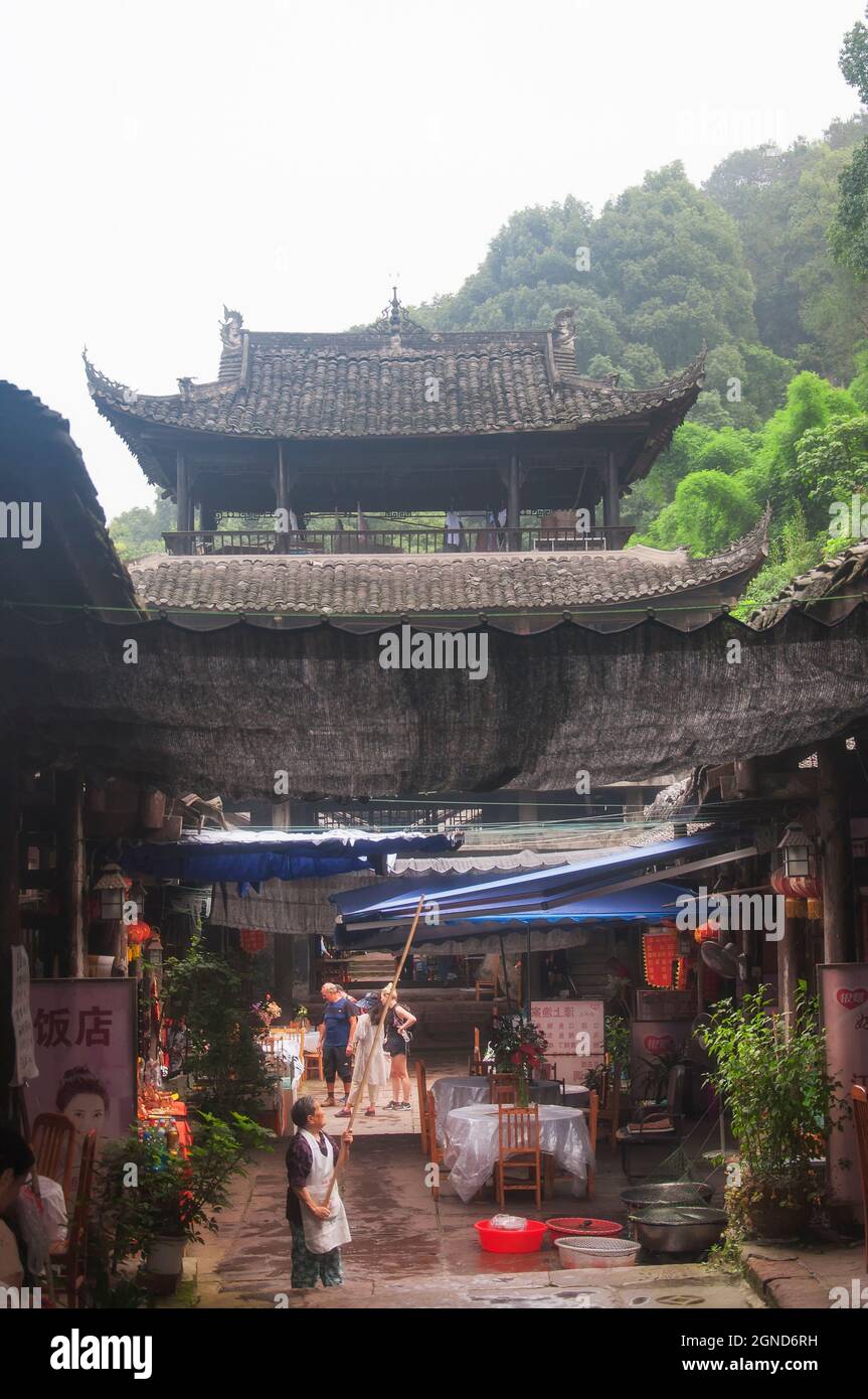 June 24, 2018. Leshan, China. People walking through a small fishing ...