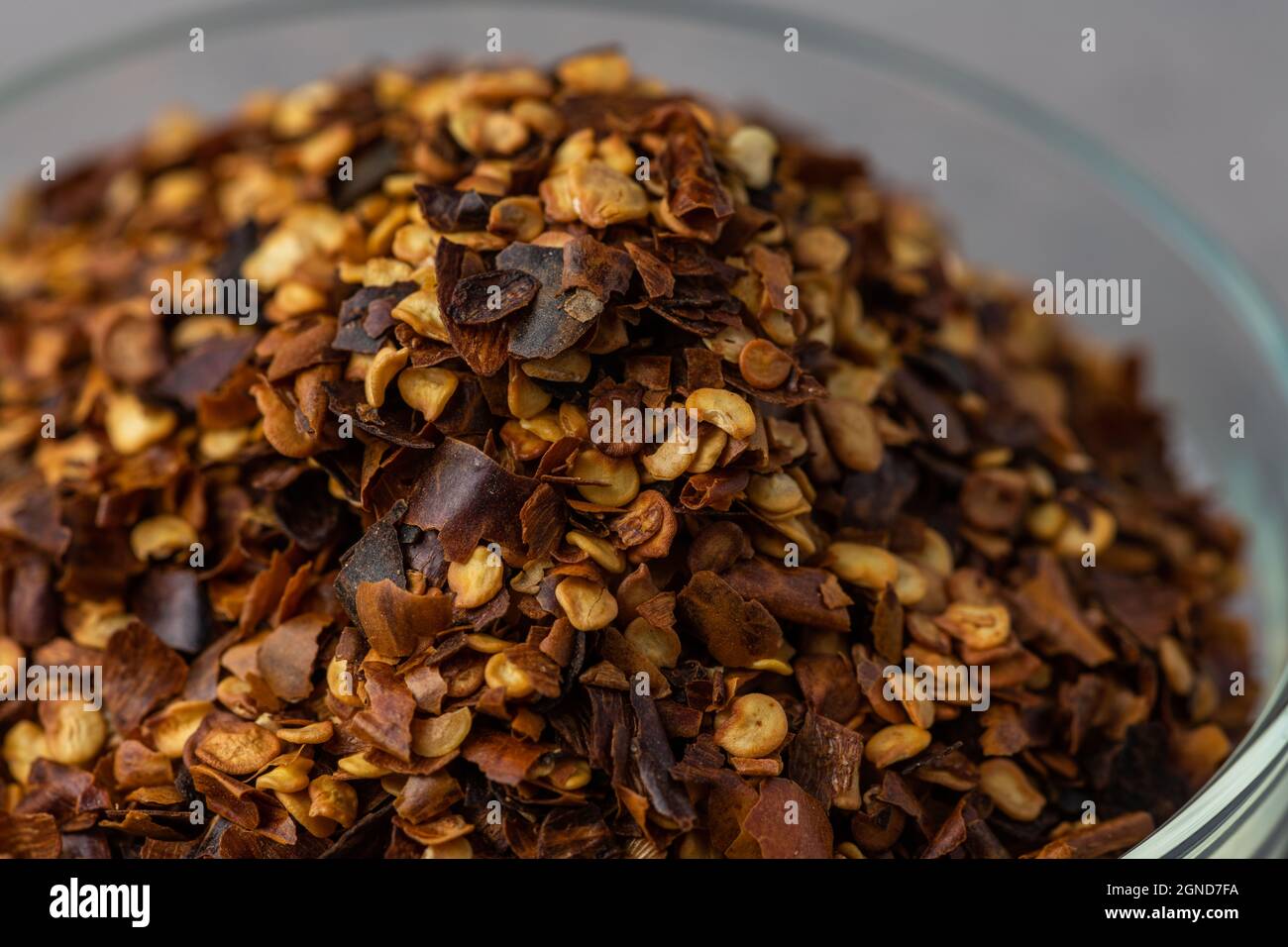 Dried chilli flakes closeup macro food image Stock Photo - Alamy