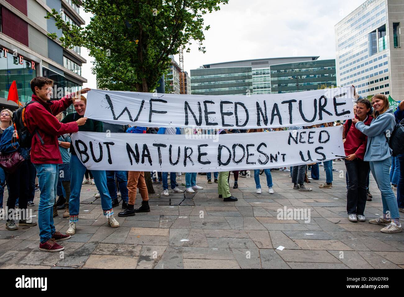 Protesters hold banners with a message in support of nature during the ...