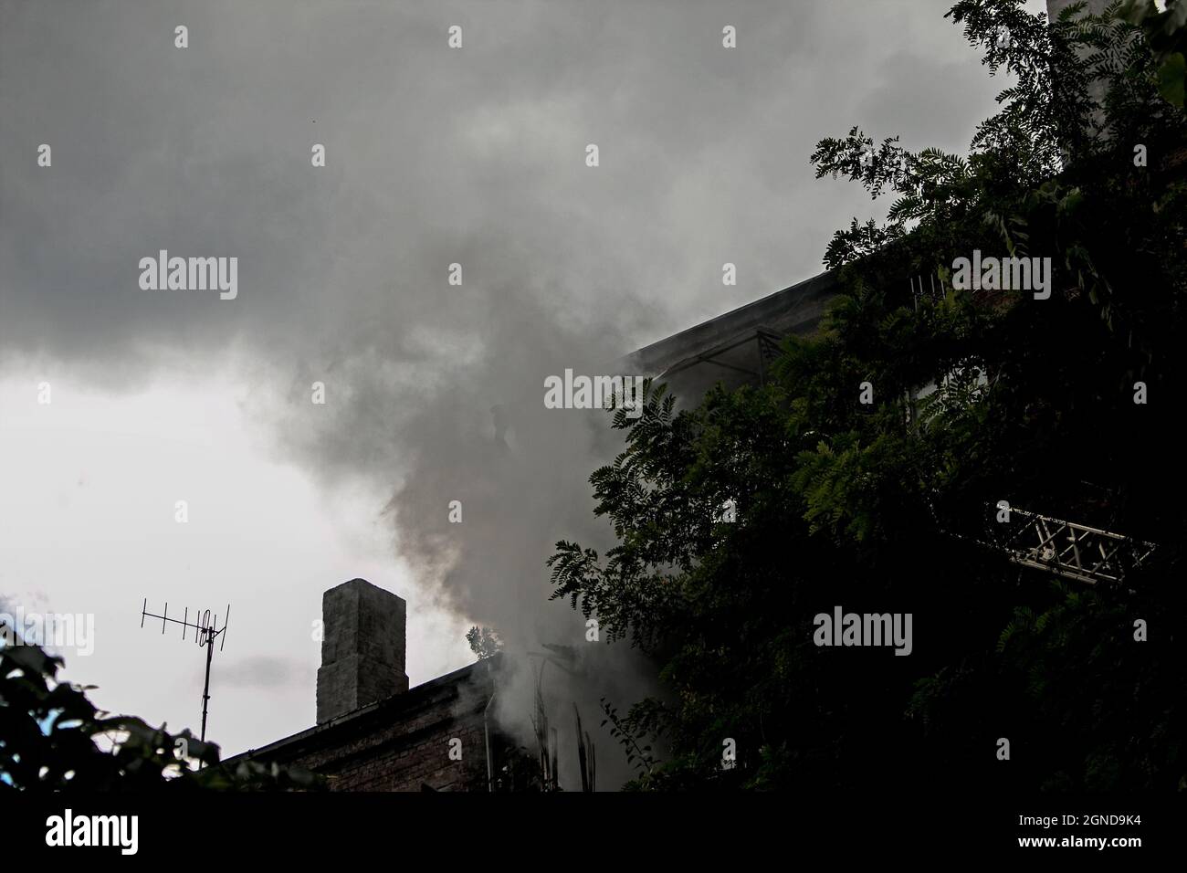 Fire in a residential five-story building. Firefighters in the basket ...